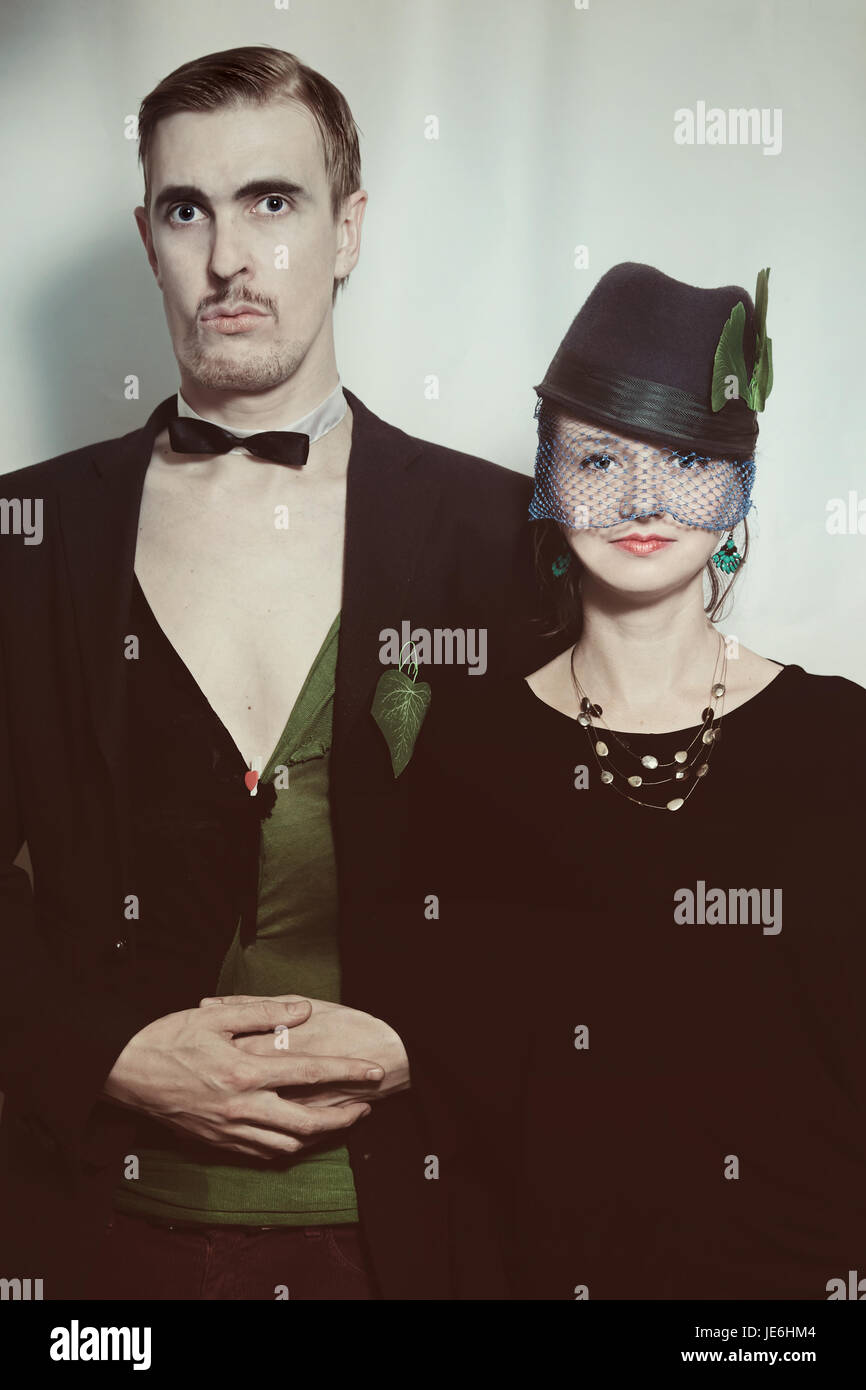 Young couple theater actors in a retro style on a light background ...