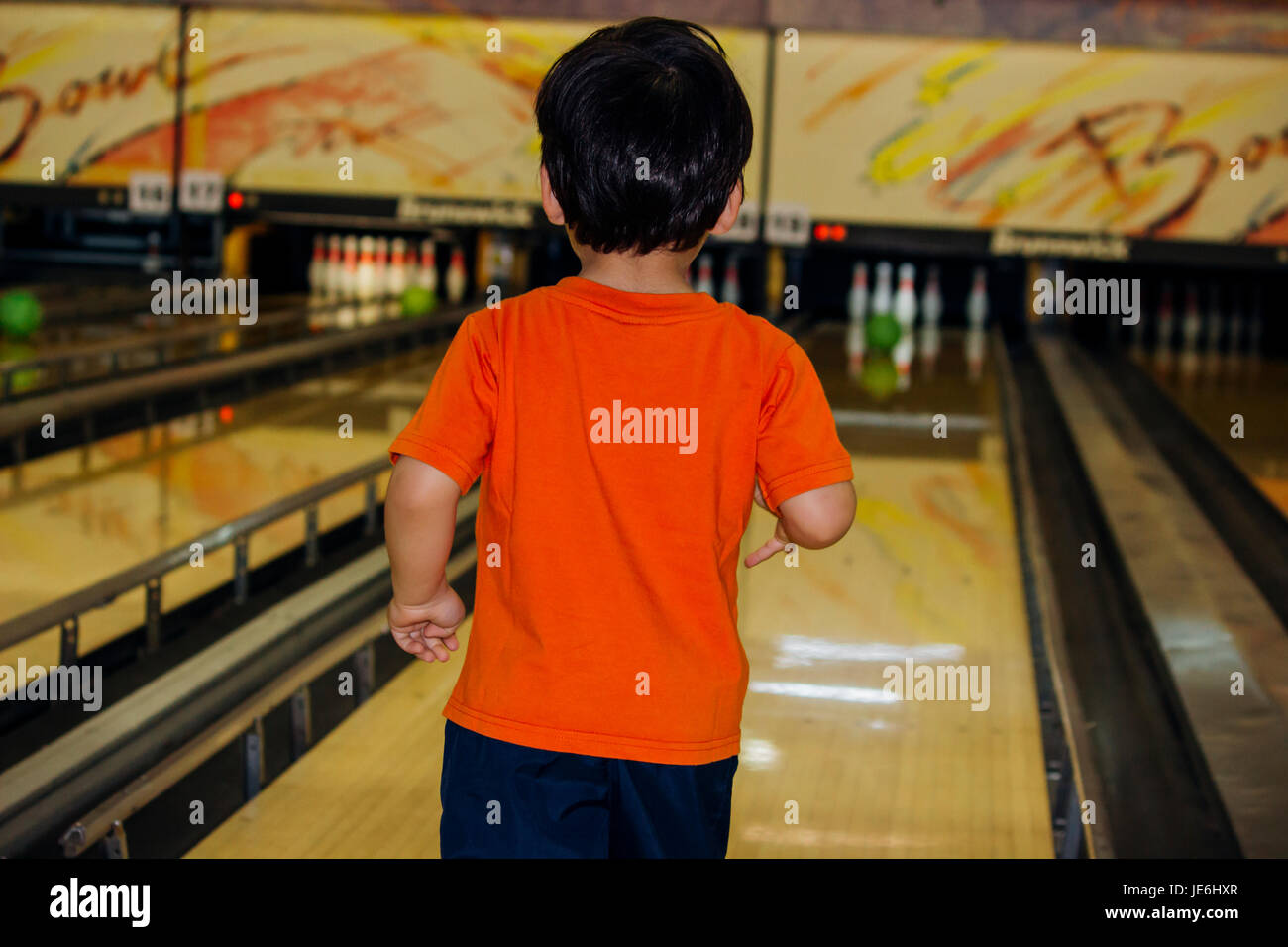 little boy playing bowl Stock Photo - Alamy