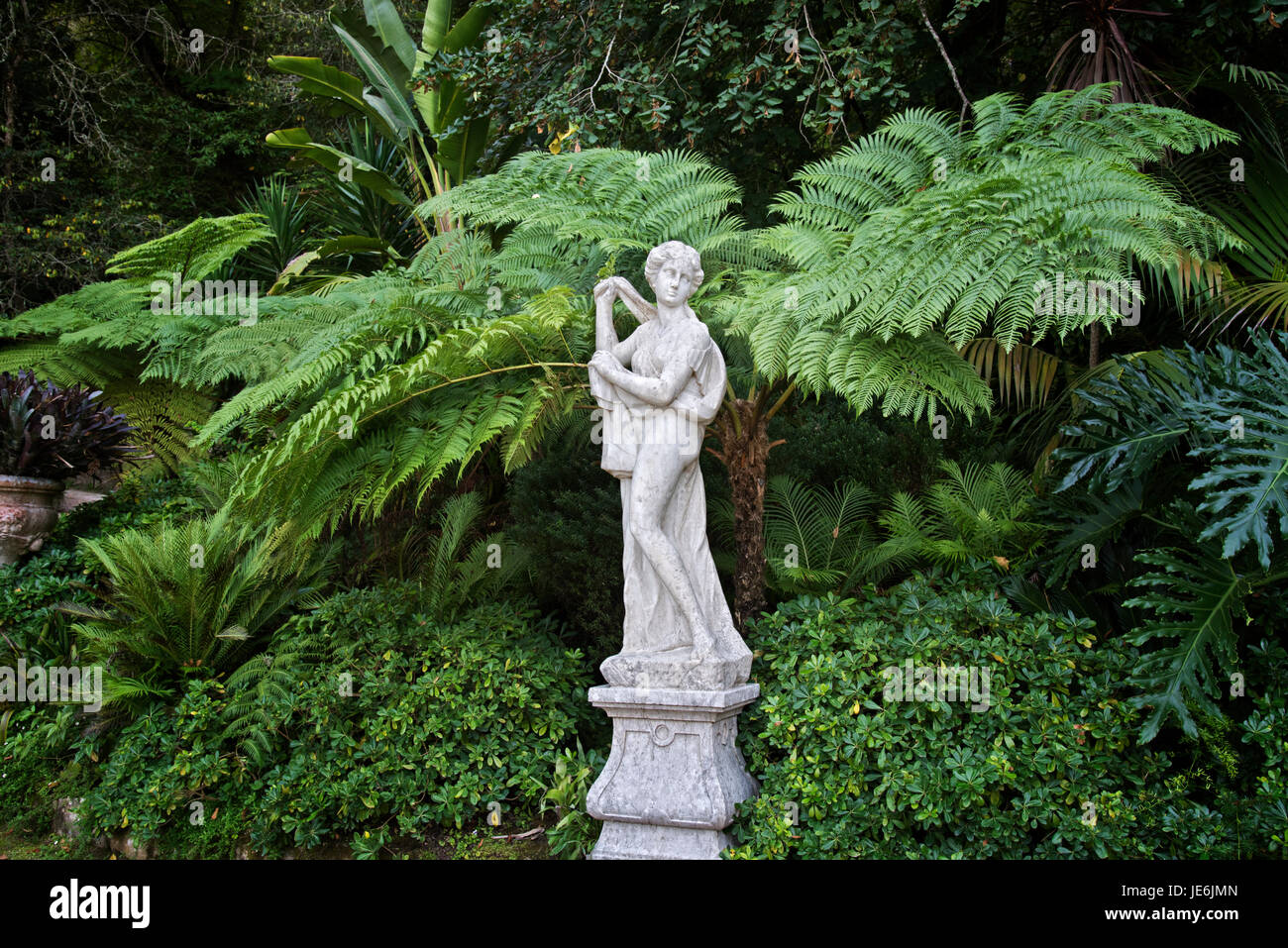 Classical statues in the luxuriant park of Quinta da Regaleira. Sintra ...