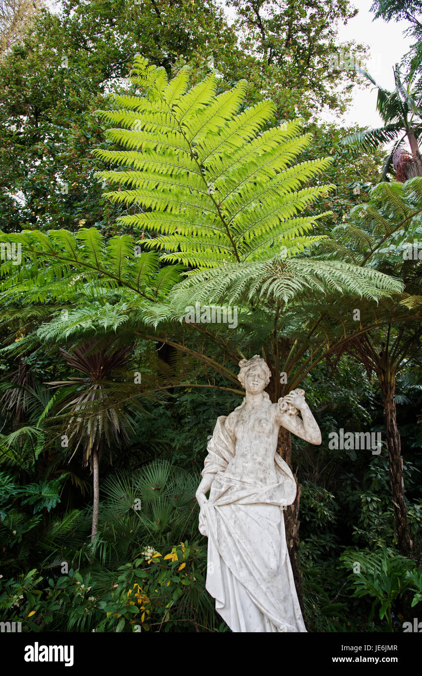 Classical statues in the luxuriant park of Quinta da Regaleira. Sintra ...