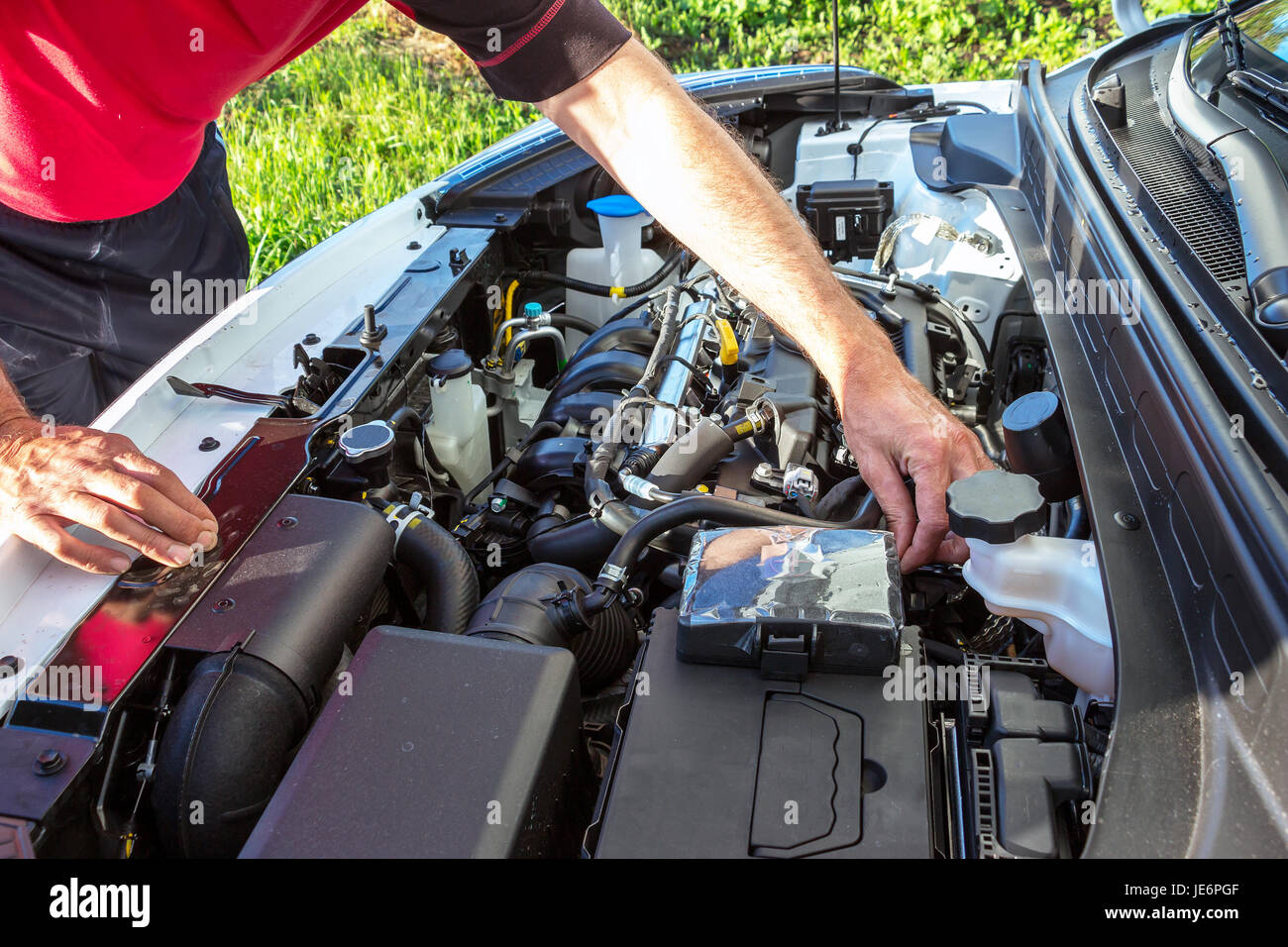 man checks the engine Stock Photo - Alamy
