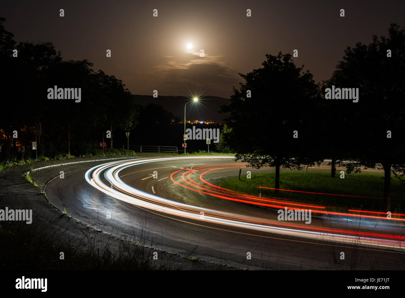 light trails from a car in a curve Stock Photo - Alamy