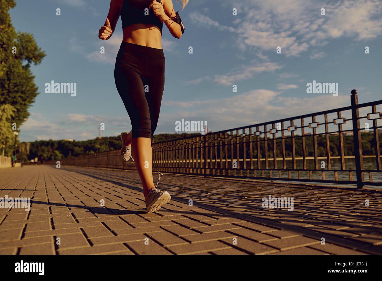 The girl is running in the park Stock Photo - Alamy