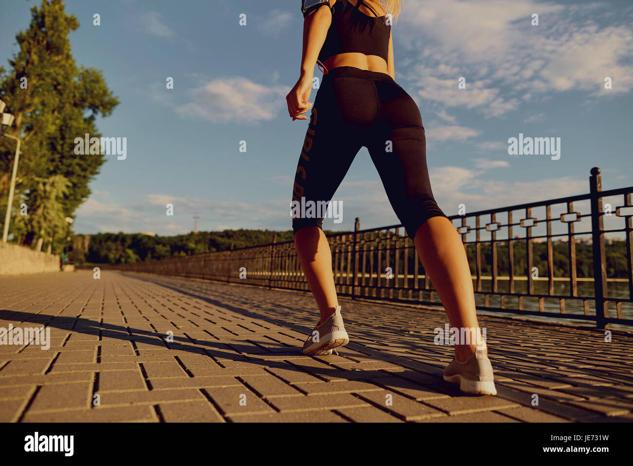 The girl is running in the park Stock Photo - Alamy