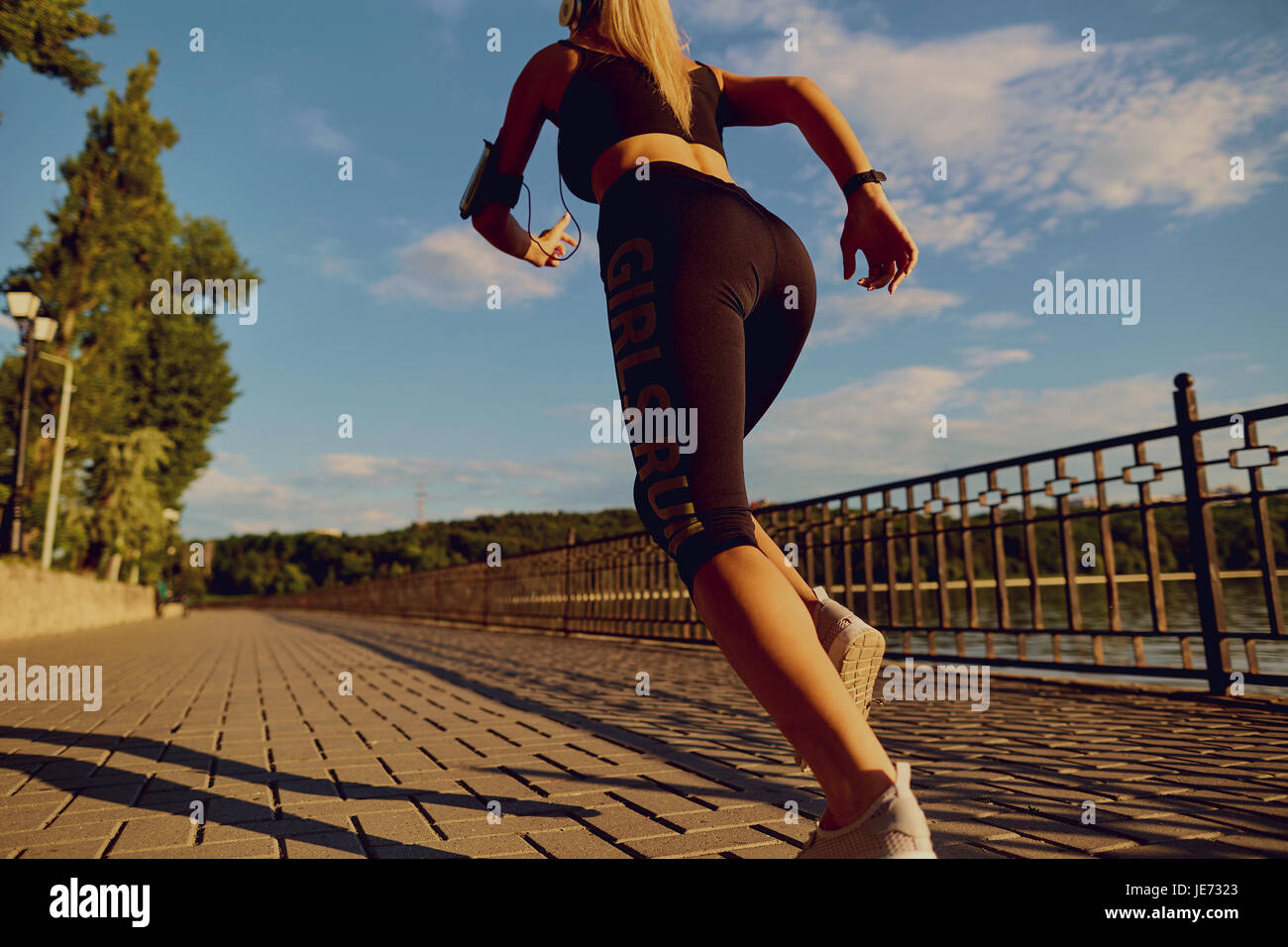 The girl is running in the park Stock Photo - Alamy