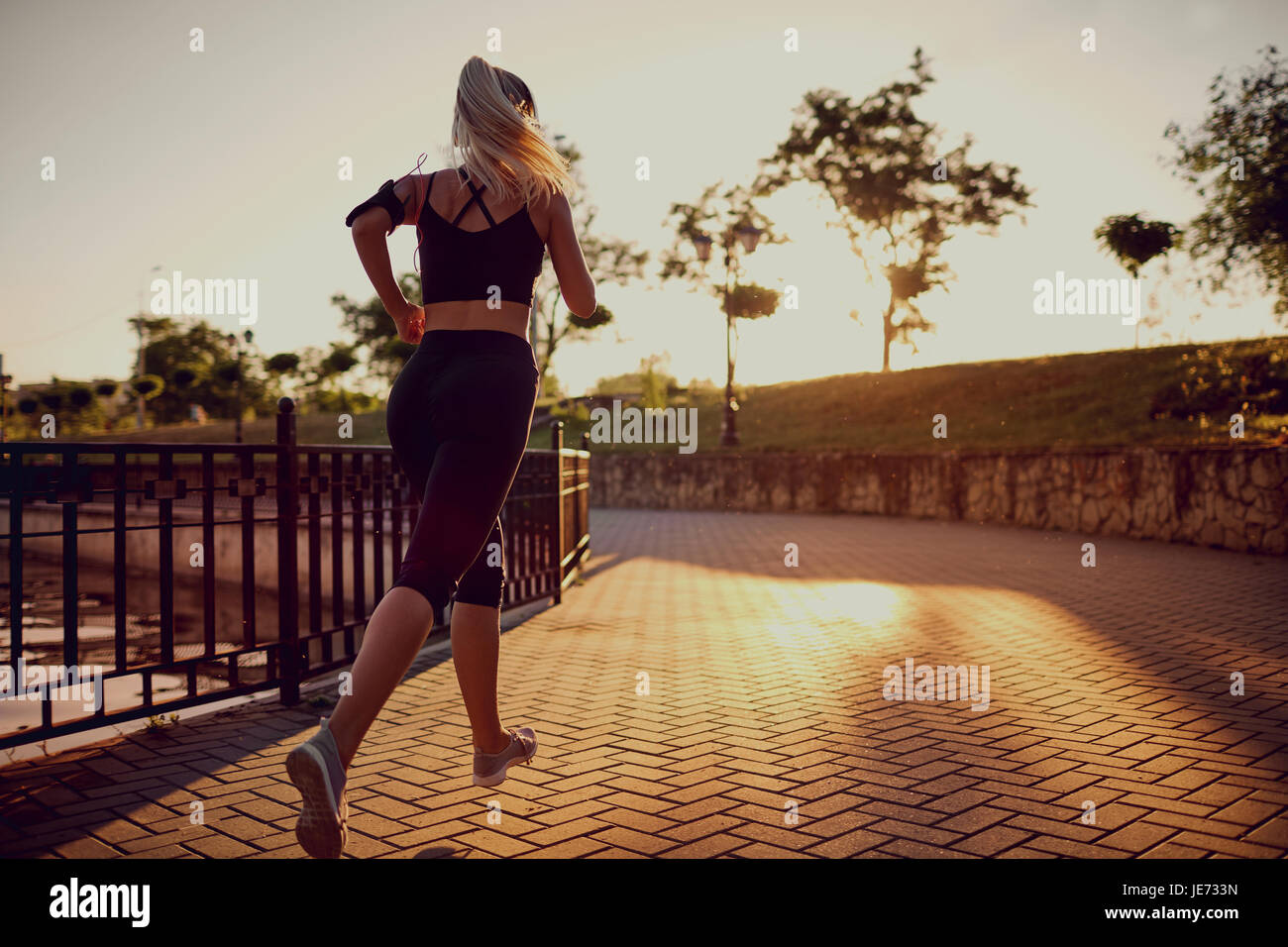The girl is running in the park Stock Photo - Alamy