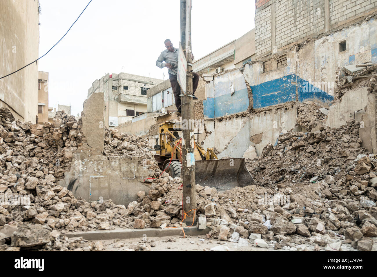 Workers try to restore infrastructure damaged in the Syrian war in ...