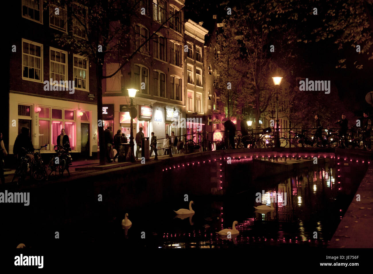 Holland, the Netherlands, Amsterdam, red light area, swans on the water ...