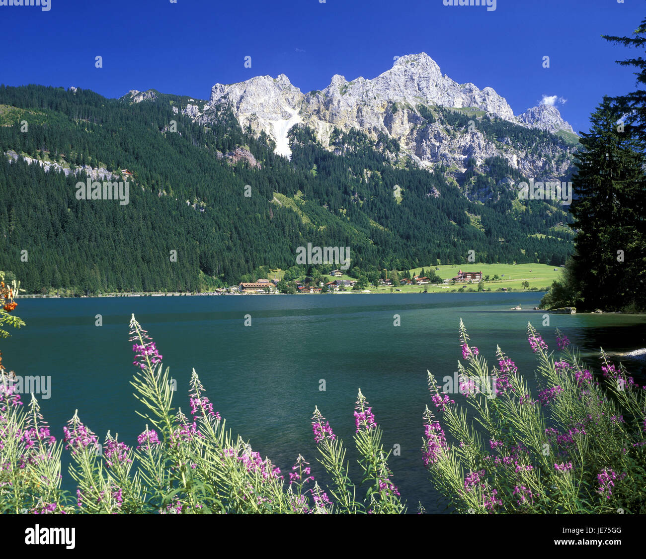 Austria, Tyrol, Tannheimer valley, waste dump lake against red Flüh ...