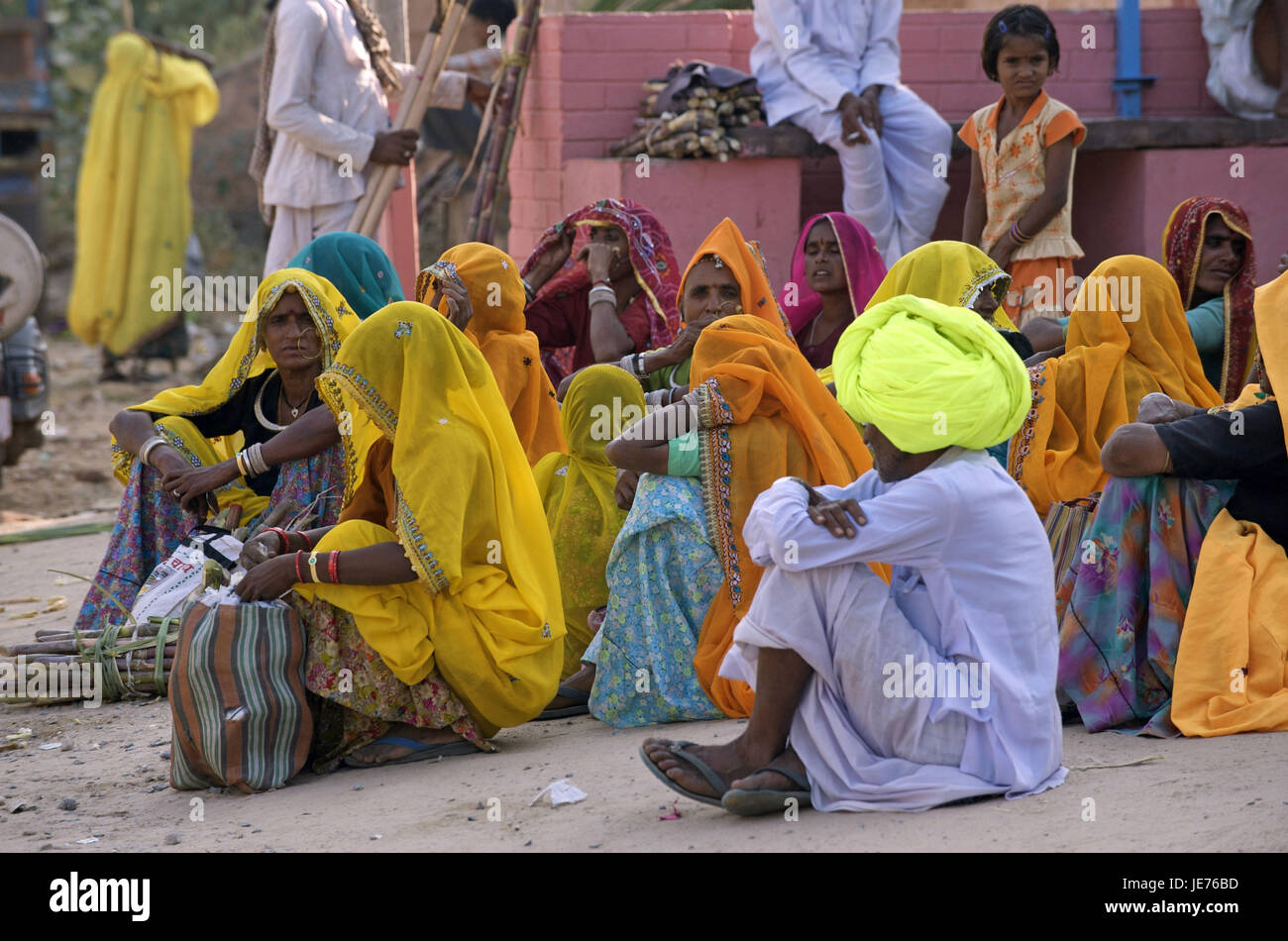 India, Rajasthan, Pushkar, women in national costume sit on the street ...