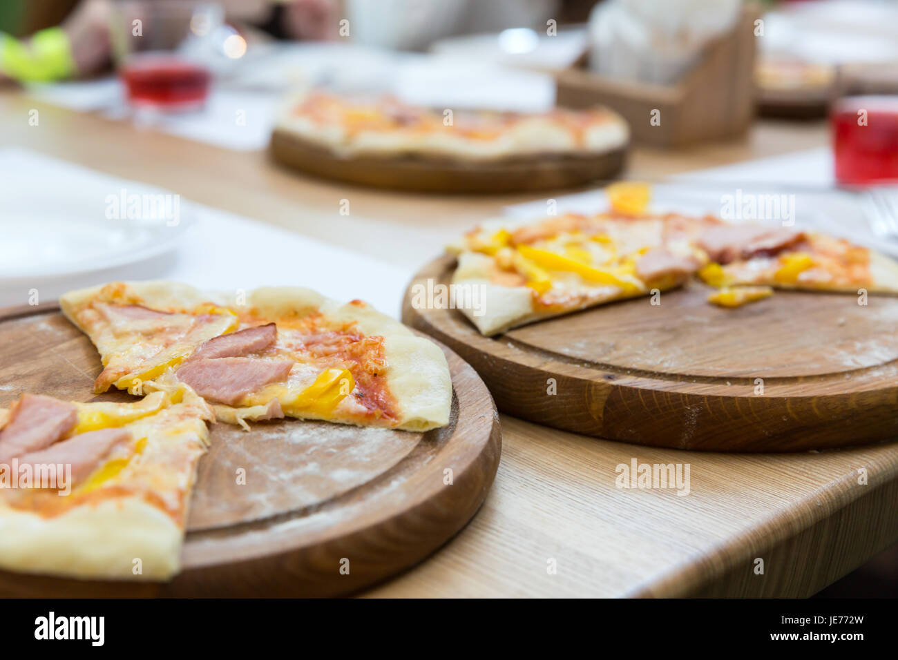 Fresh pizza on a wooden stand closeup. Traditional italian dish Stock ...