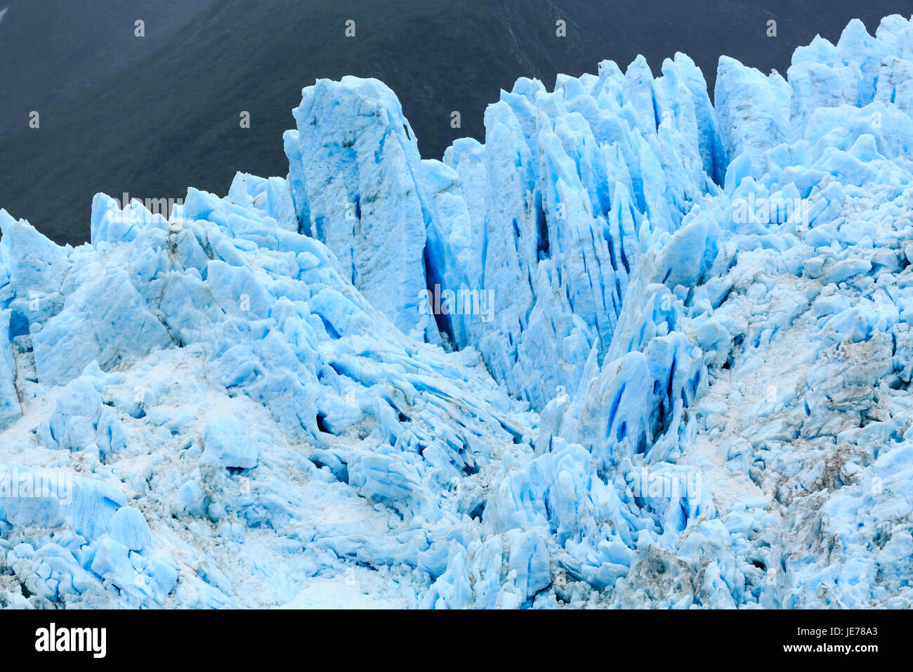 Sharp spires of blue glacial ice create natural, beautiful design and ...