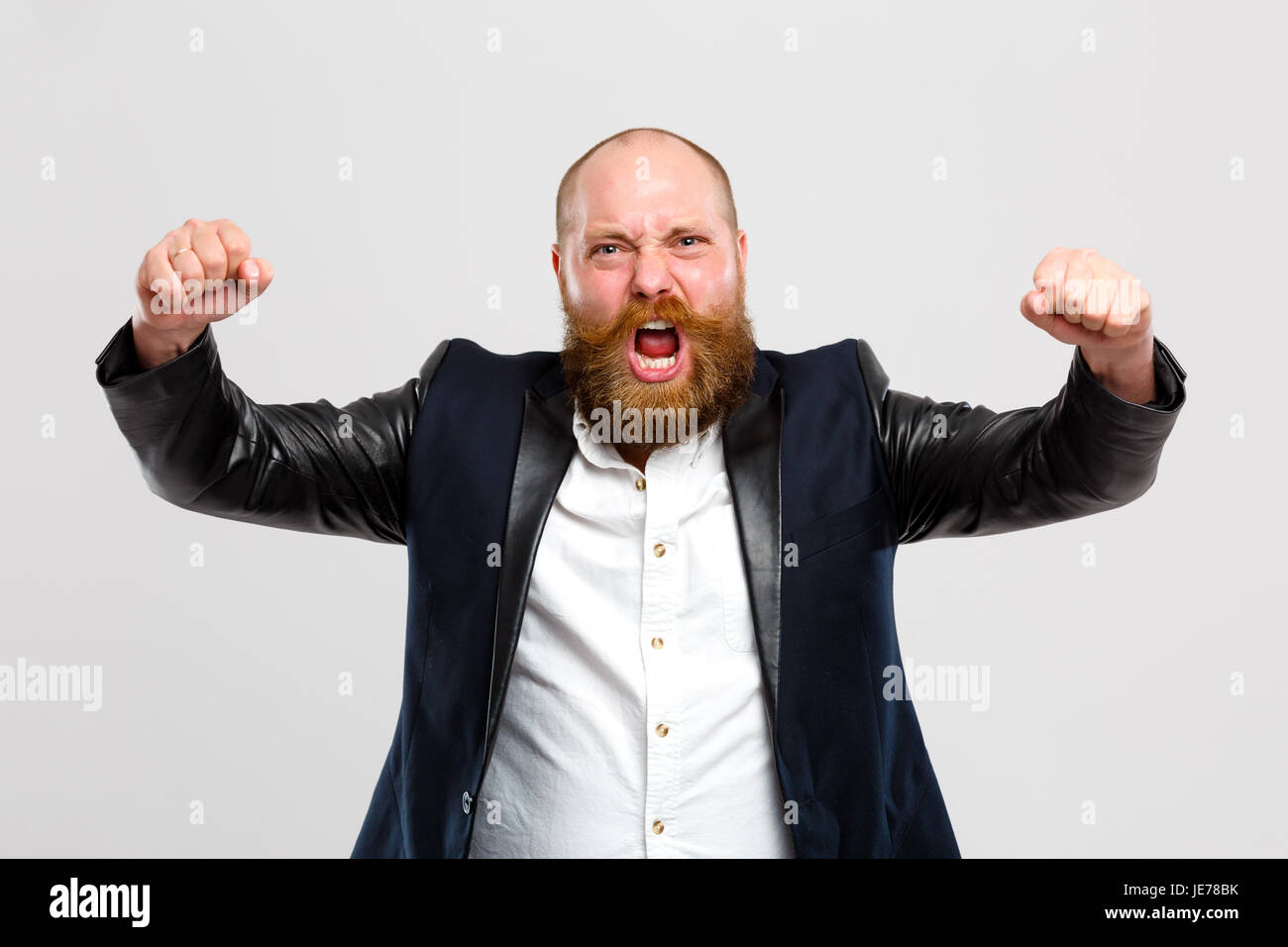 Evil screaming man with hands up on clean gray background Stock Photo ...