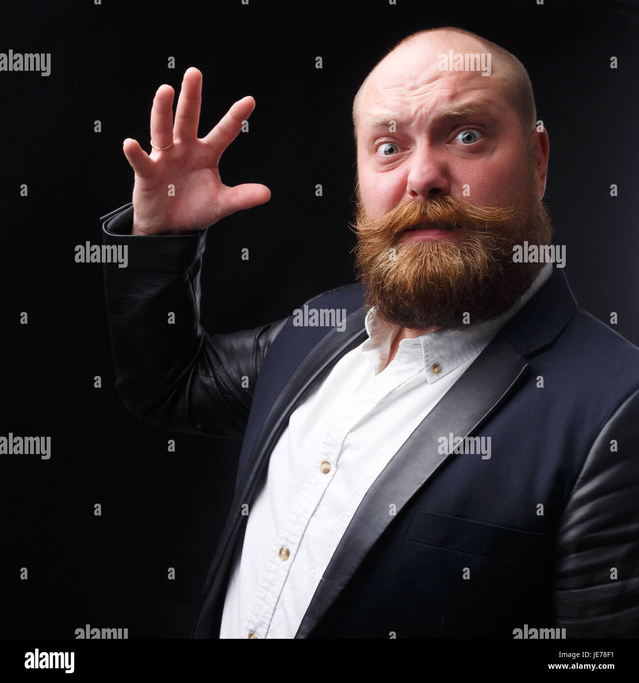 Angry man with ginger beard and mustache waved hand on empty background ...