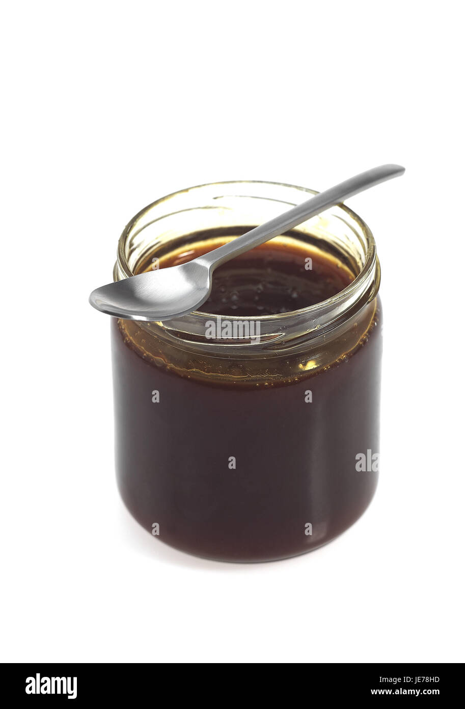 Glass, syrup, spoon, white background Stock Photo - Alamy