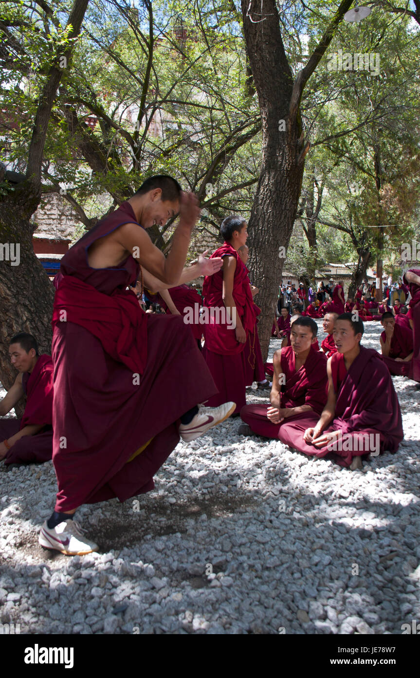 Young monks with the everyday discussion hour in the saga temple, Lhasa ...