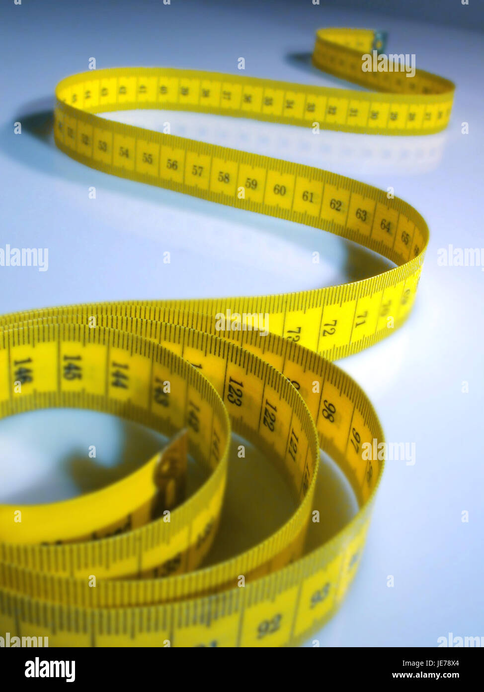 Tape measure, yellow, medium close-up Stock Photo - Alamy