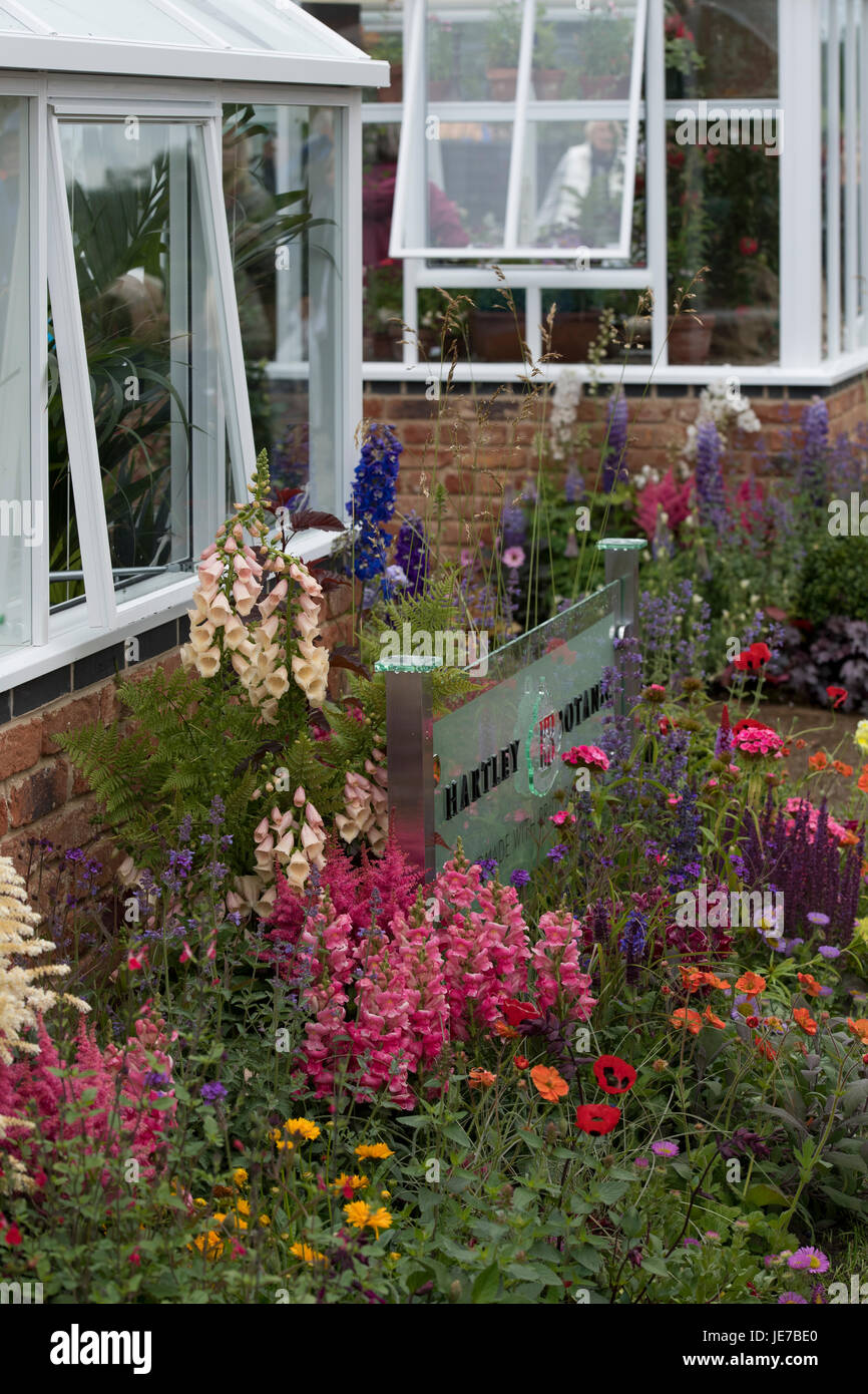 Hartley Botanic trade stand with greenhouses & flowering plants on ...