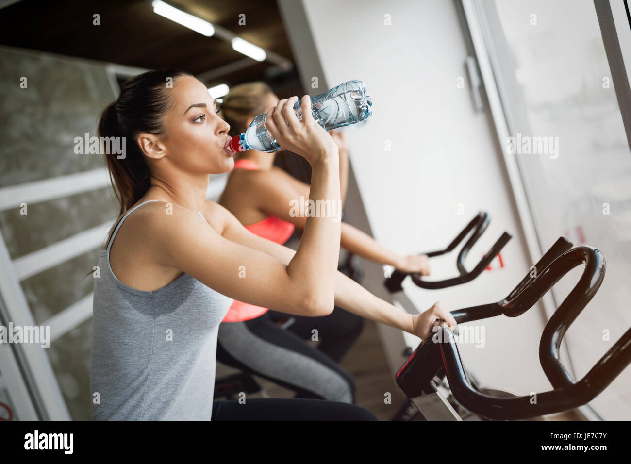 Young friends riding bike hi-res stock photography and images - Alamy