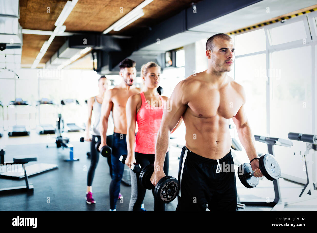 Group of people have workout in gym Stock Photo - Alamy