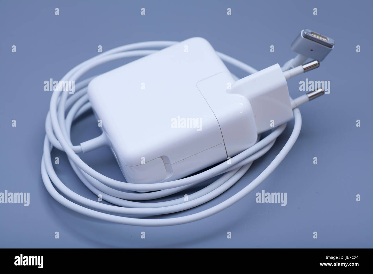 Electrical adapter to USB port on a gray background Stock Photo - Alamy