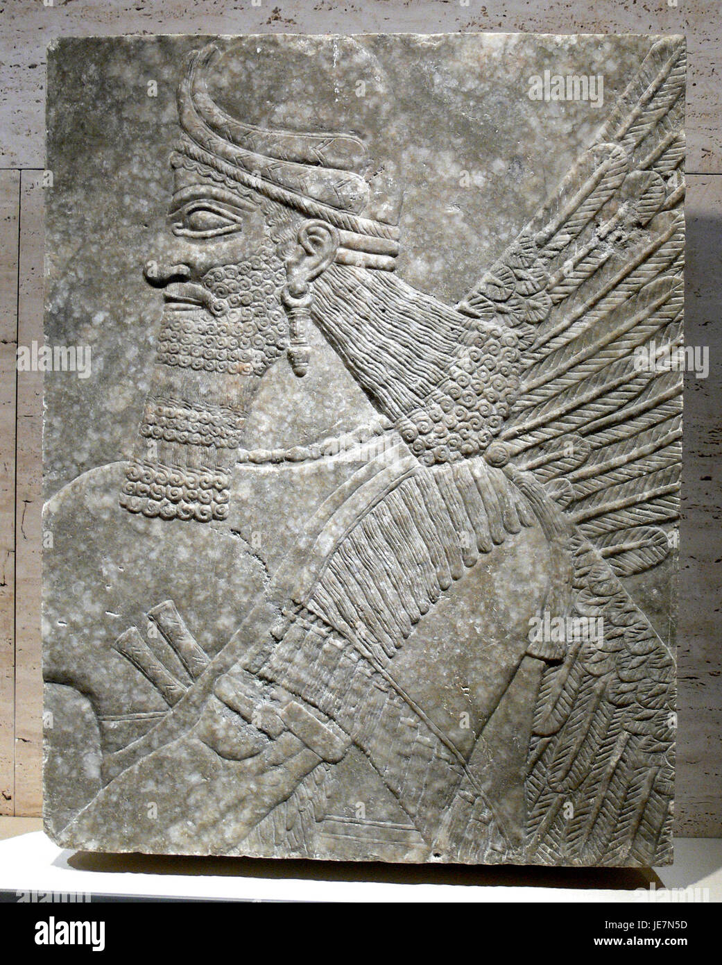 The Assyrian winged deities are ancient sculptures that represent ...