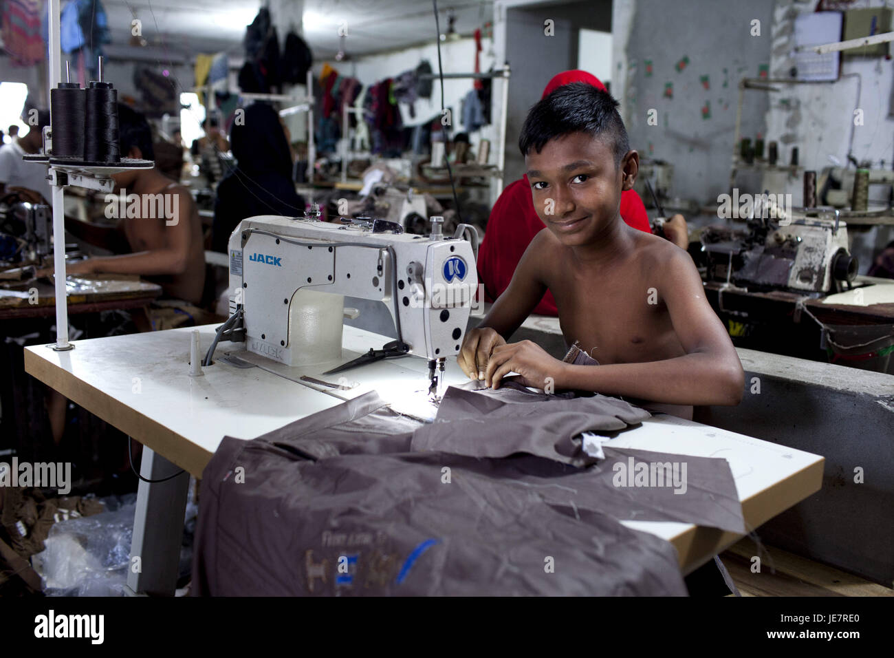 Child labor factory sewing hi-res stock photography and images - Alamy
