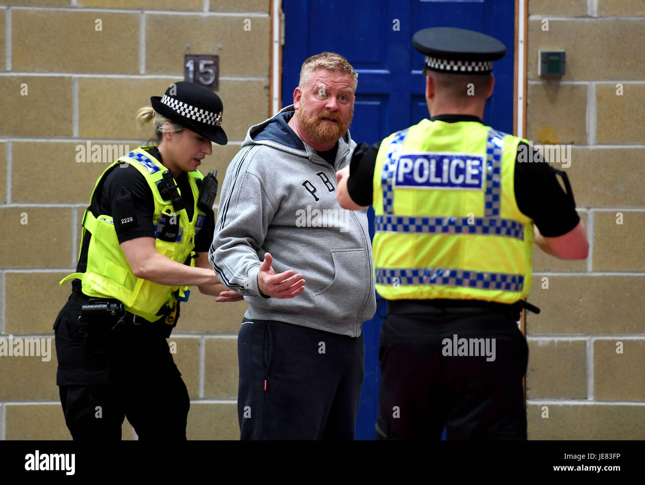 Police officers demonstrate attending a domestic incident during ...