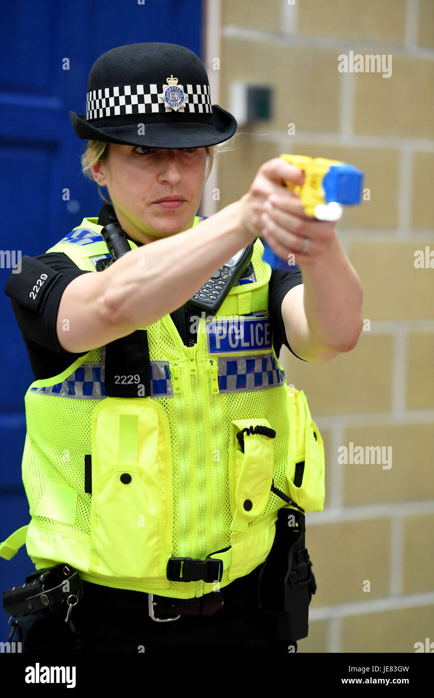 Taser, police officer using a taser during training. The focus of the ...