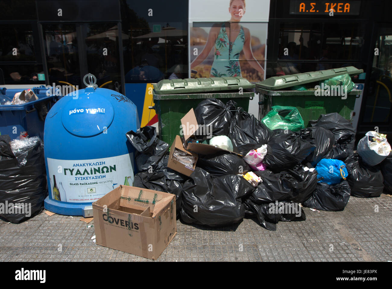 Thessaloniki, Greece, 23rd June, 2017. A city bus drives pass piles of ...