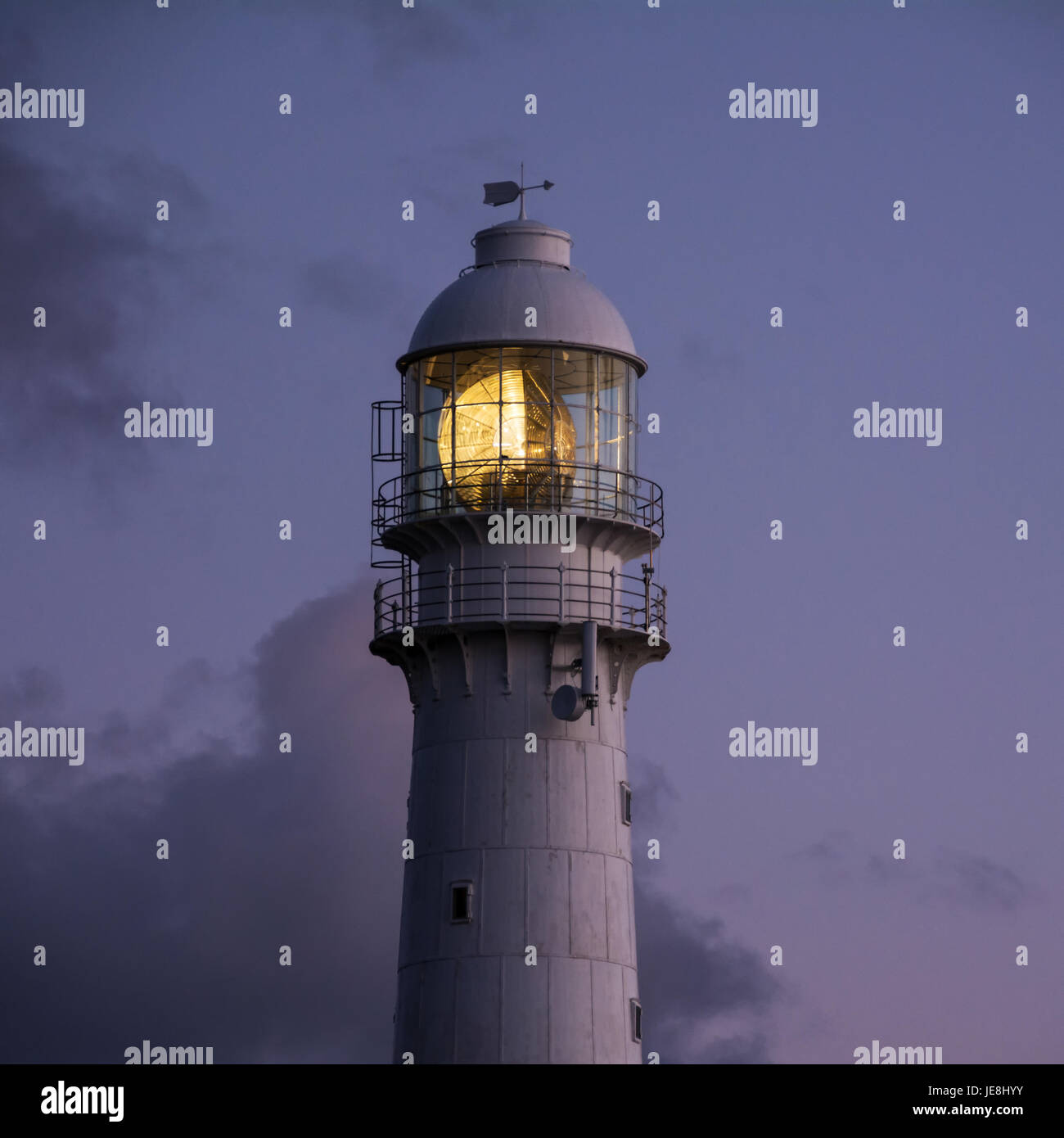 A lighthouse tower at sunset Stock Photo - Alamy