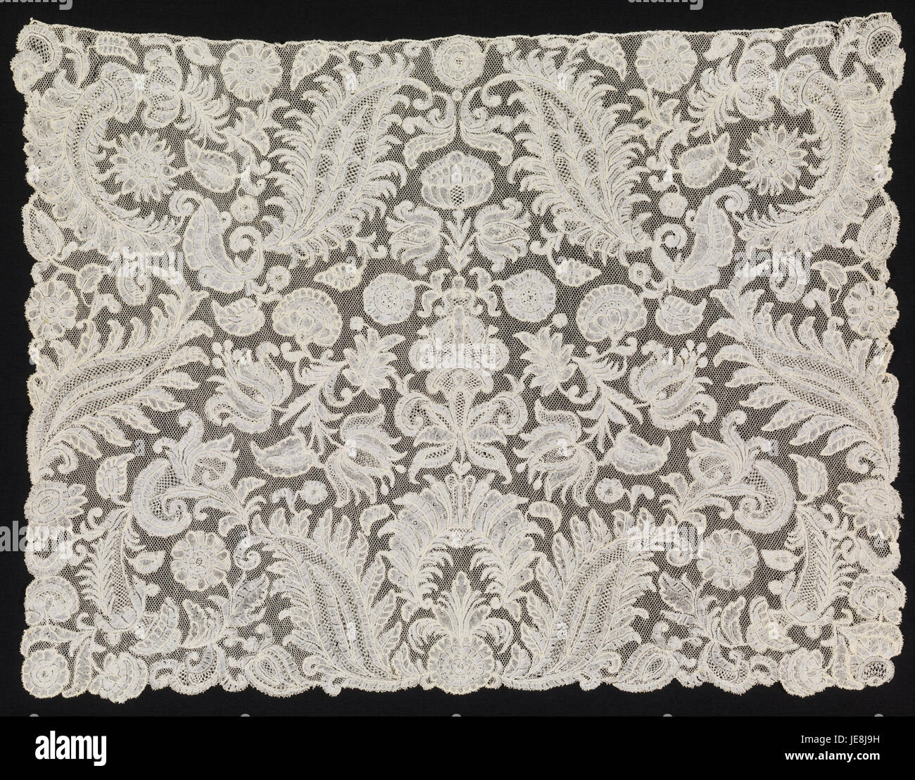 This image features the end of a cravat, showing its intricate fabric ...