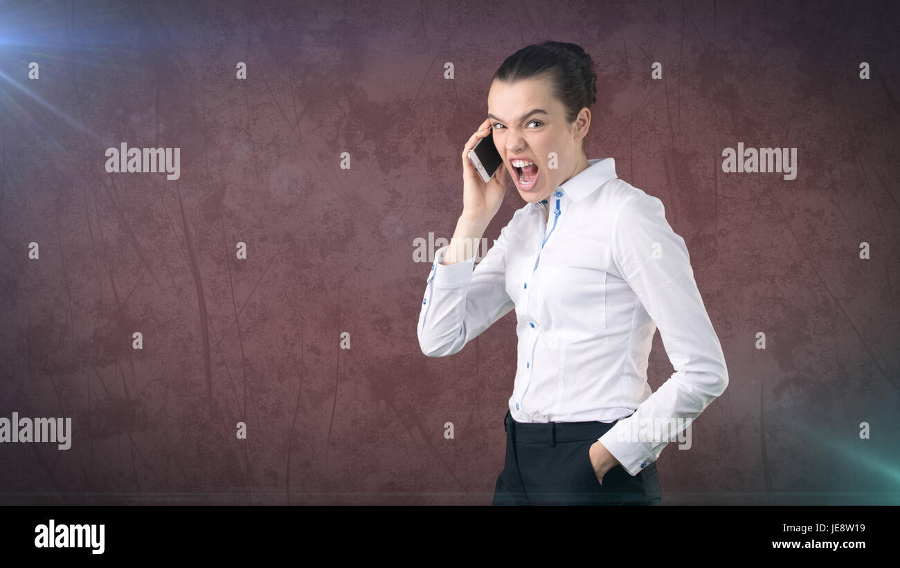 Angry businesswoman, standing by side, talking by mobile phone ...