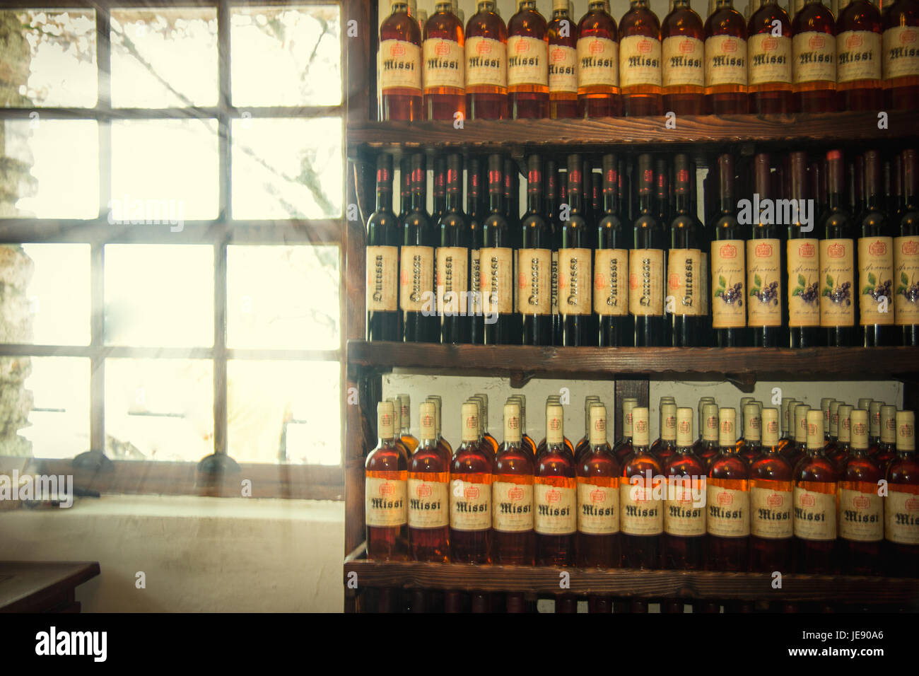 light rays in a small wine cellar with a hand made wine bottles ...