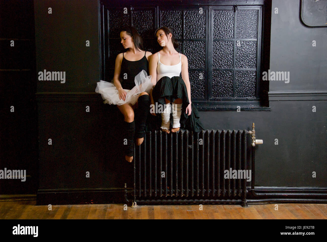 Two girl dancers practicing in the dance studio Stock Photo - Alamy