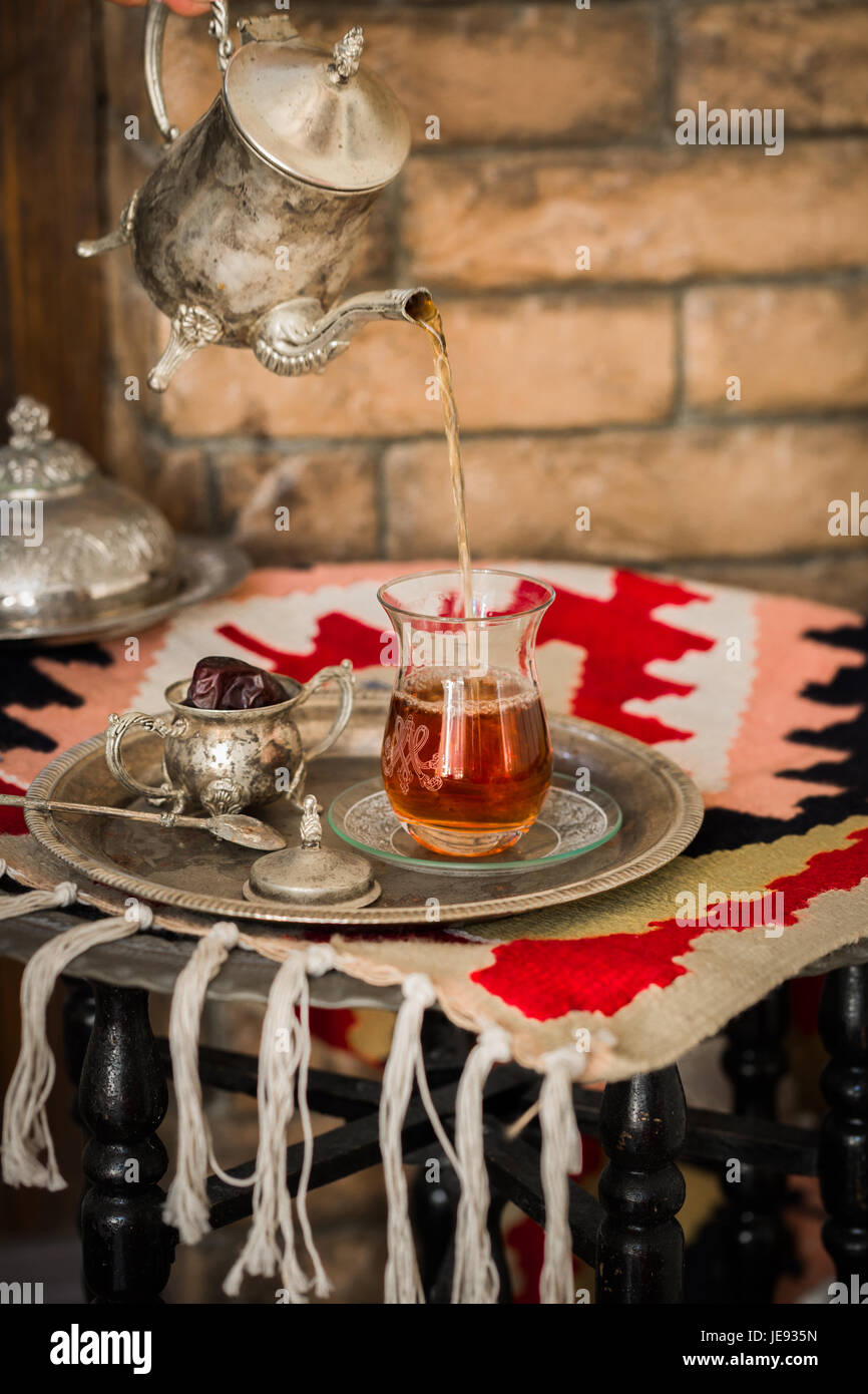 Tea set in oriental style in pear shaped glass with spoon and vintage ...