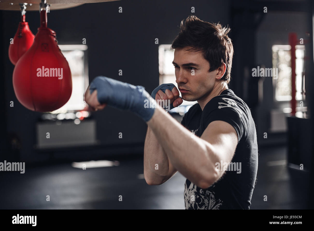Young man boxing workout in a fitness club Stock Photo - Alamy