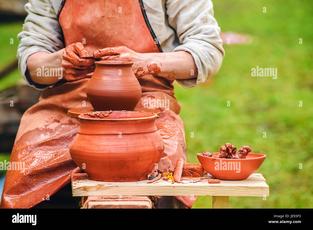 manufacturing pitcher hands on a rotating frame Stock Photo - Alamy