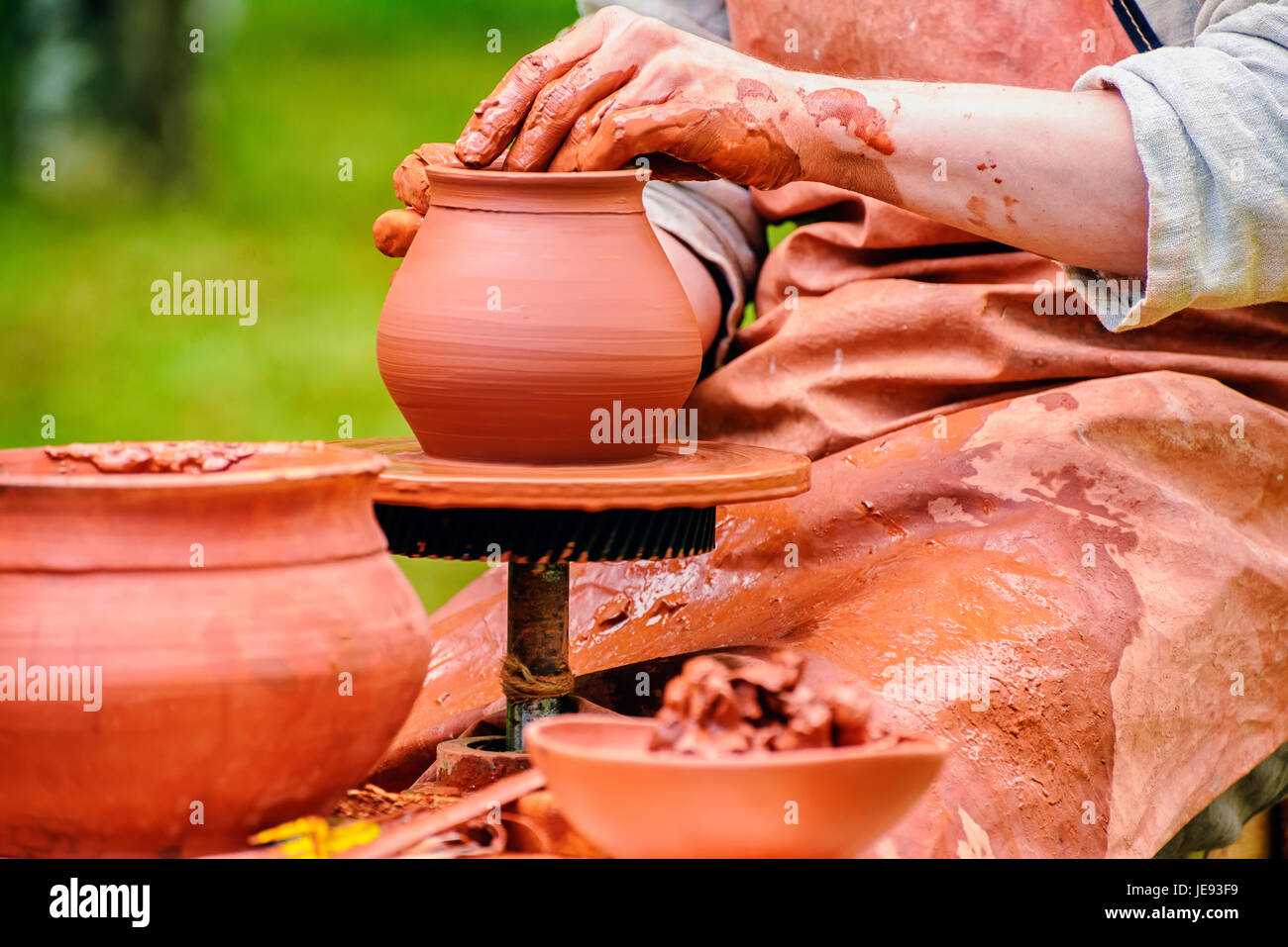 manufacturing pitcher hands on a rotating frame Stock Photo - Alamy