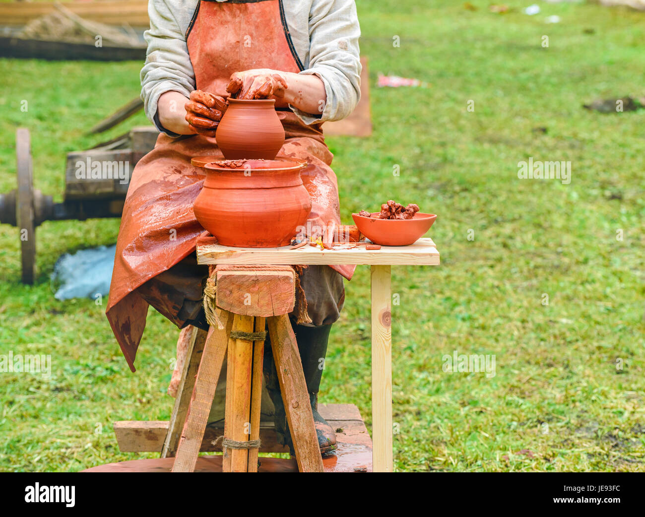 manufacturing pitcher hands on a rotating frame Stock Photo - Alamy