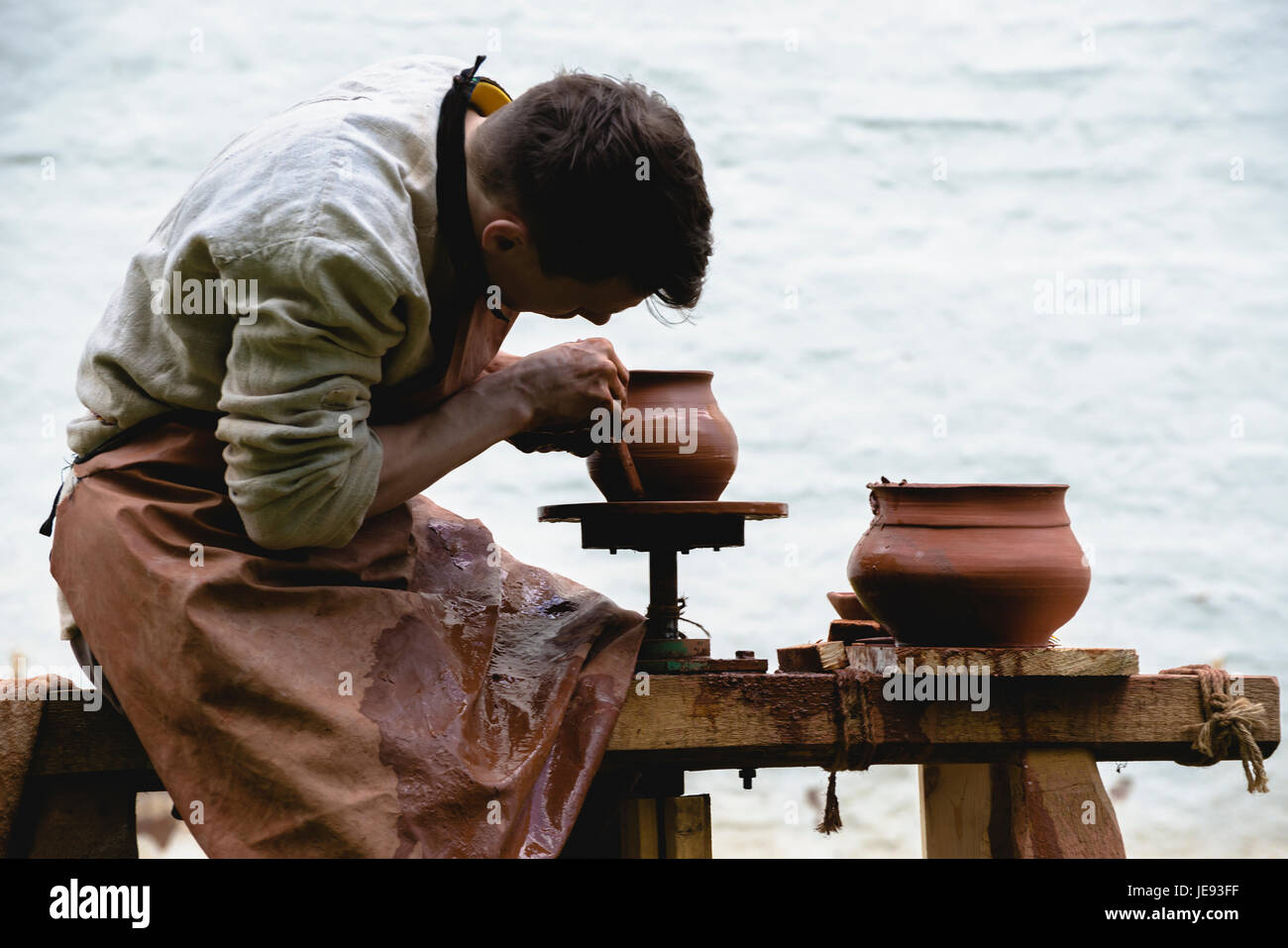 manufacturing pitcher hands on a rotating frame Stock Photo - Alamy