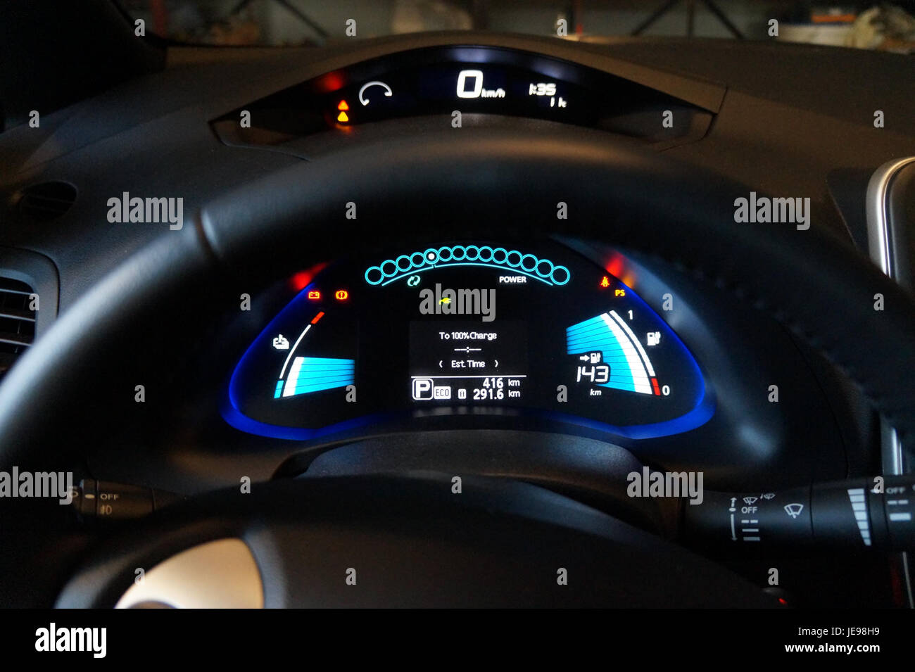 The dashboard of the 2013 Nissan Leaf, an all-electric vehicle, features a modern design focused ...