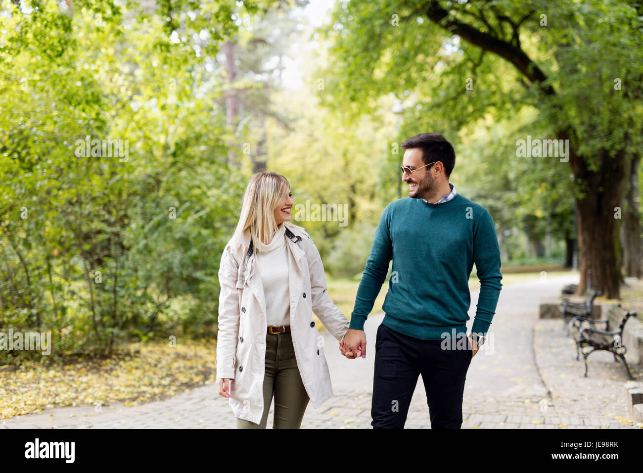 Young beautiful couple in love walking together Stock Photo - Alamy