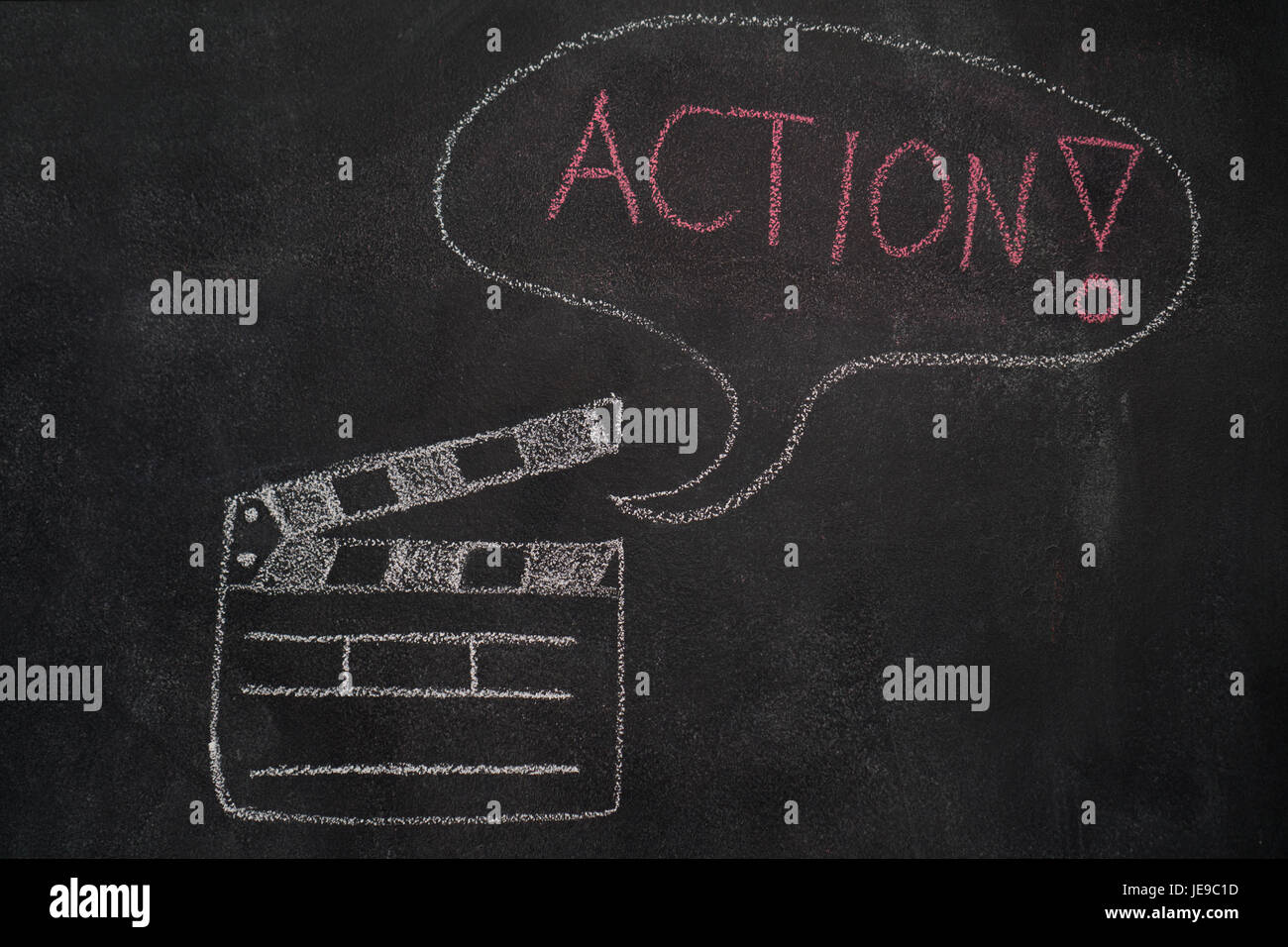Open movie clapper and speech bubble with action word drawn with chalk ...