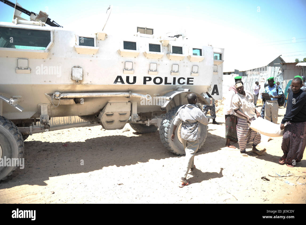AMISOM police officers participate in a food donation event on February ...