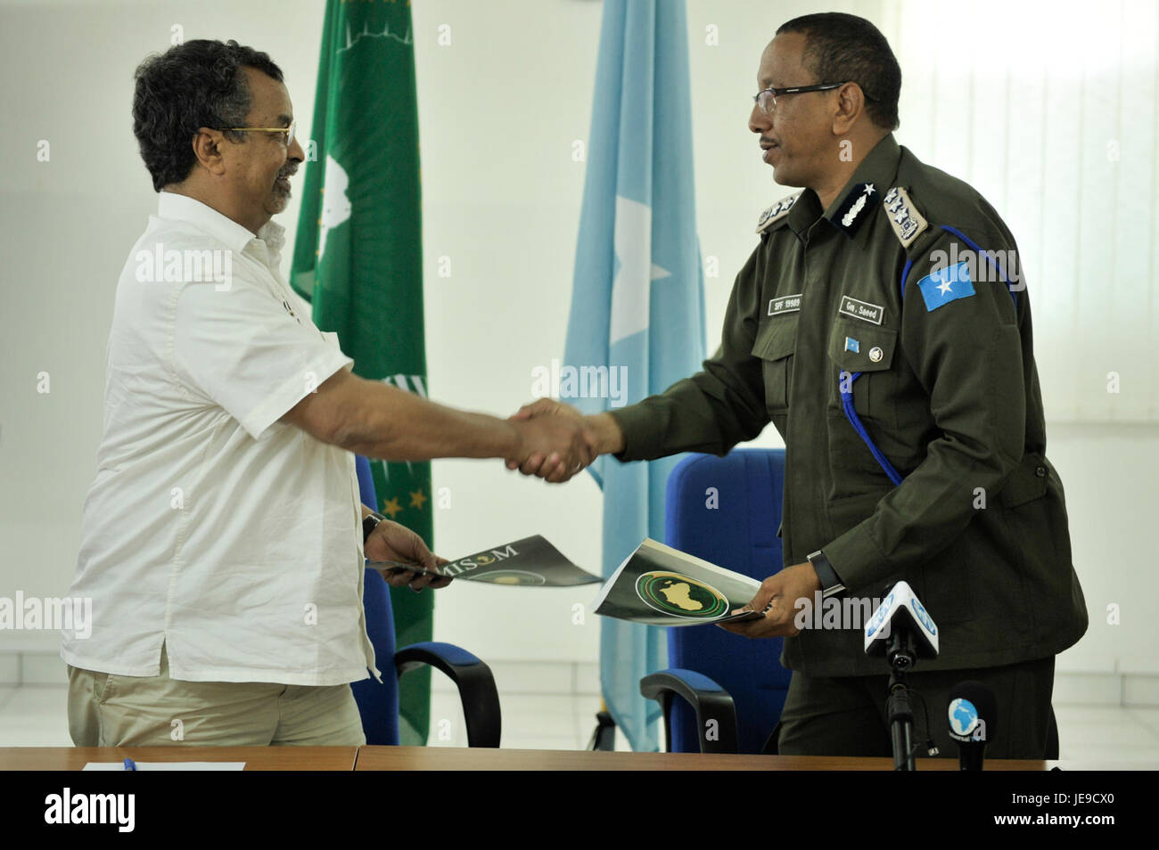 The image depicts a vehicle handover event that took place in 2014. It ...