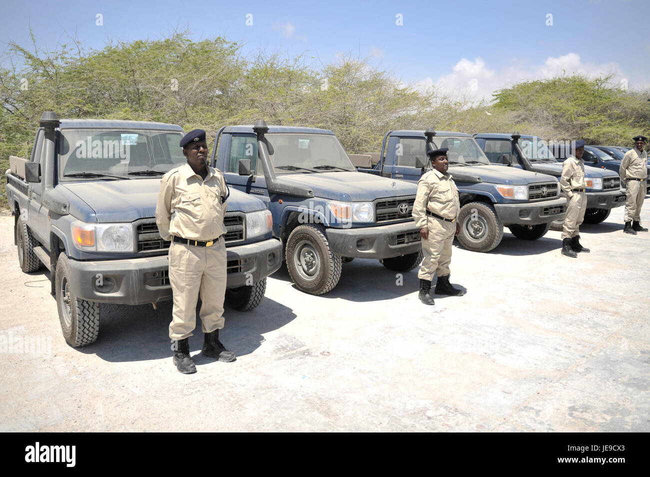 Image of a vehicle handover event held on March 1, 2014. It shows ...