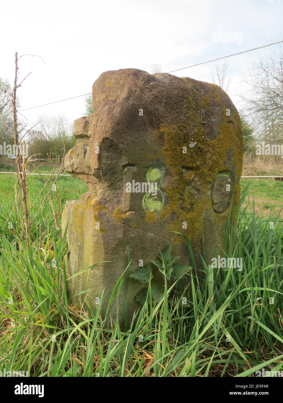 The image depicts a boundary stone (Grenzstein) located in Almet ...