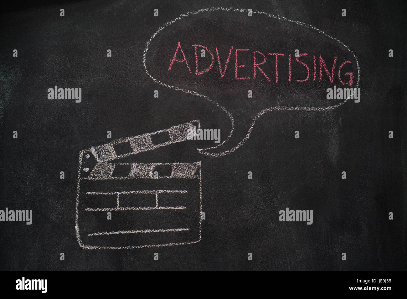 Open movie clapper and speech bubble with advertising word drawn with ...