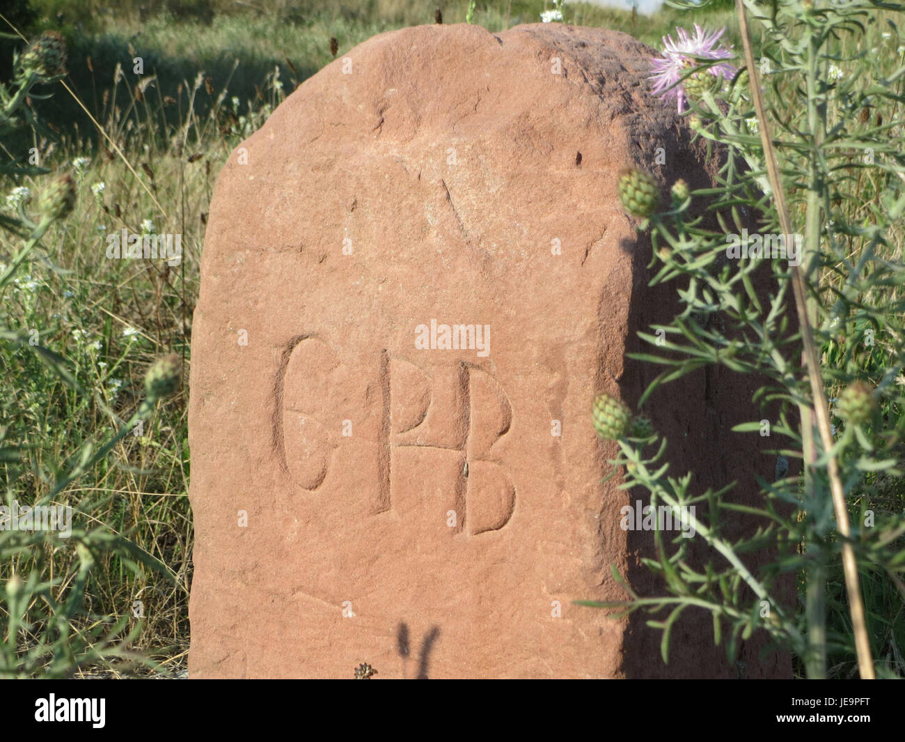 A photograph of a boundary stone from July 23, 2014, marking a land ...